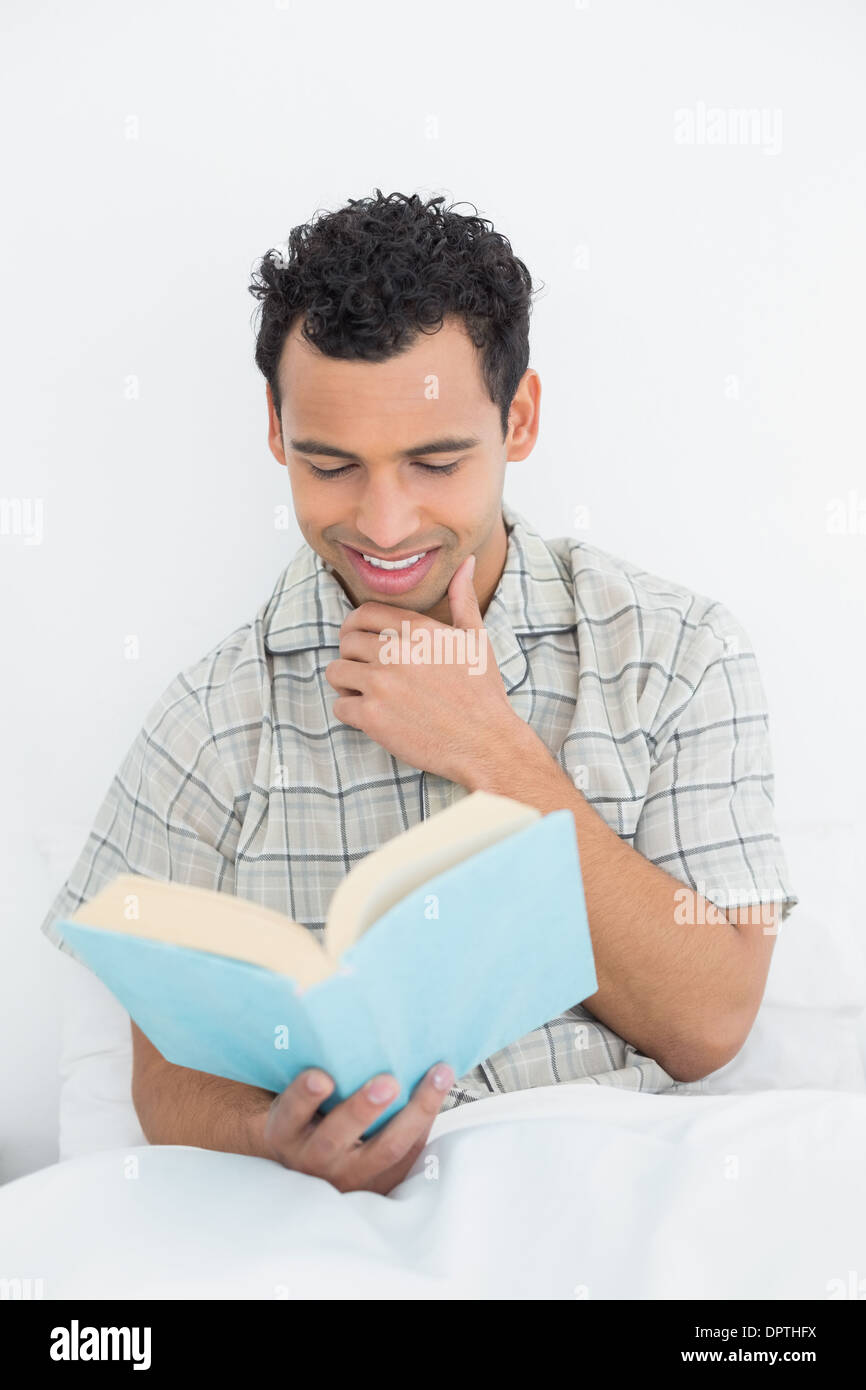 Smart handsome man reading book hi-res stock photography and images - Alamy