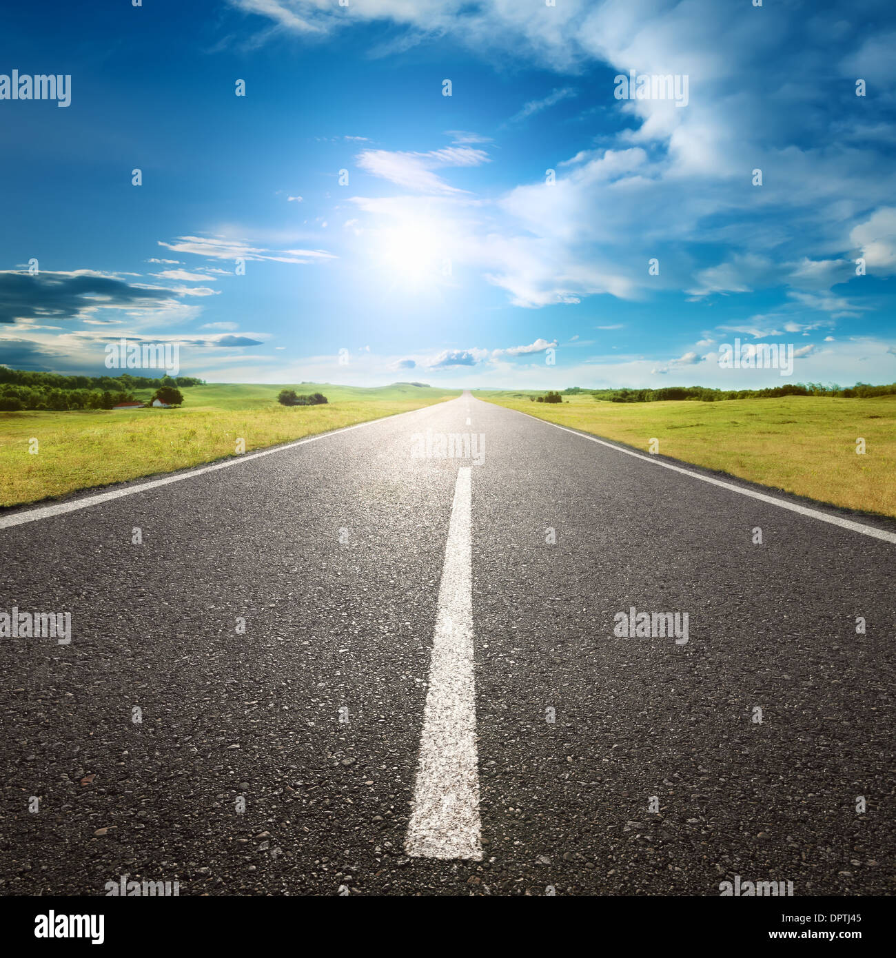 Driving on an empty road to the sun Stock Photo - Alamy