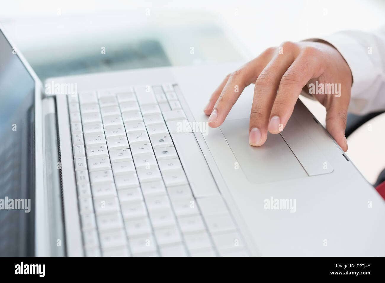 Hand using laptop at office desk Stock Photo - Alamy