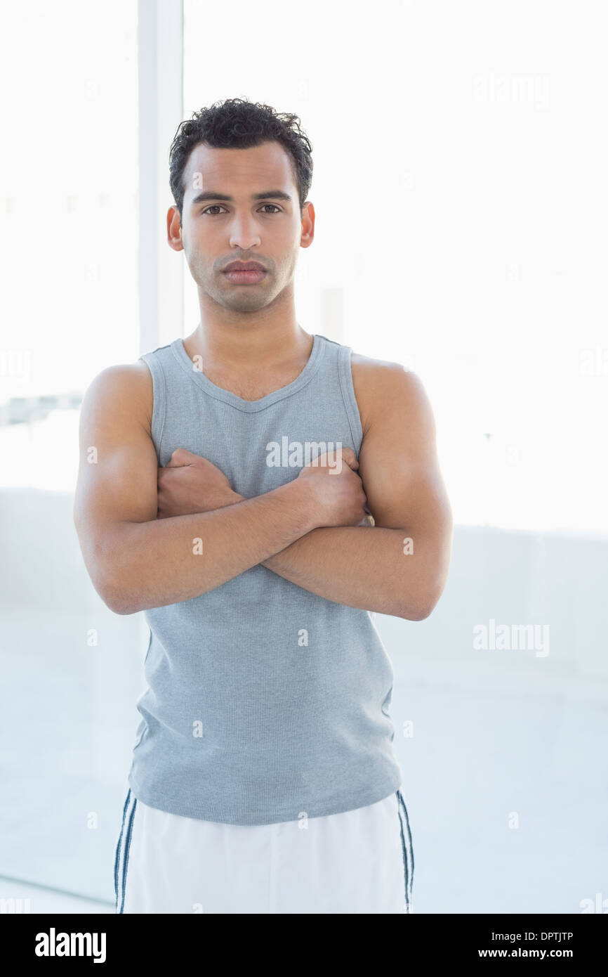 Serious muscular man arms folded hi-res stock photography and images ...