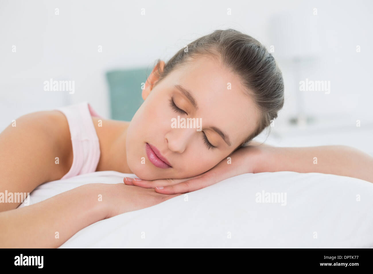 Pretty woman sleeping with eyes closed in bed Stock Photo - Alamy