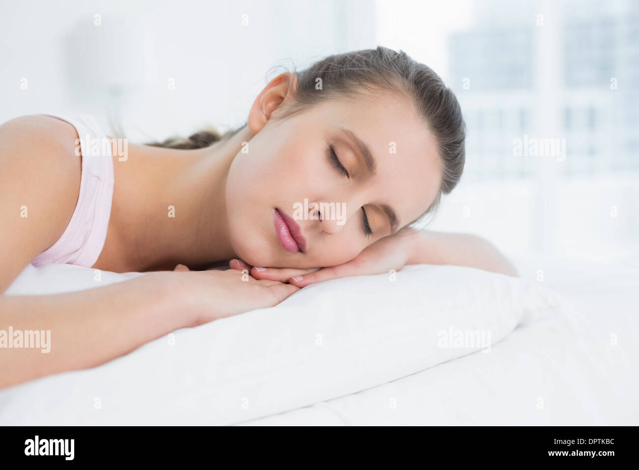 Pretty woman sleeping with eyes closed in bed Stock Photo - Alamy