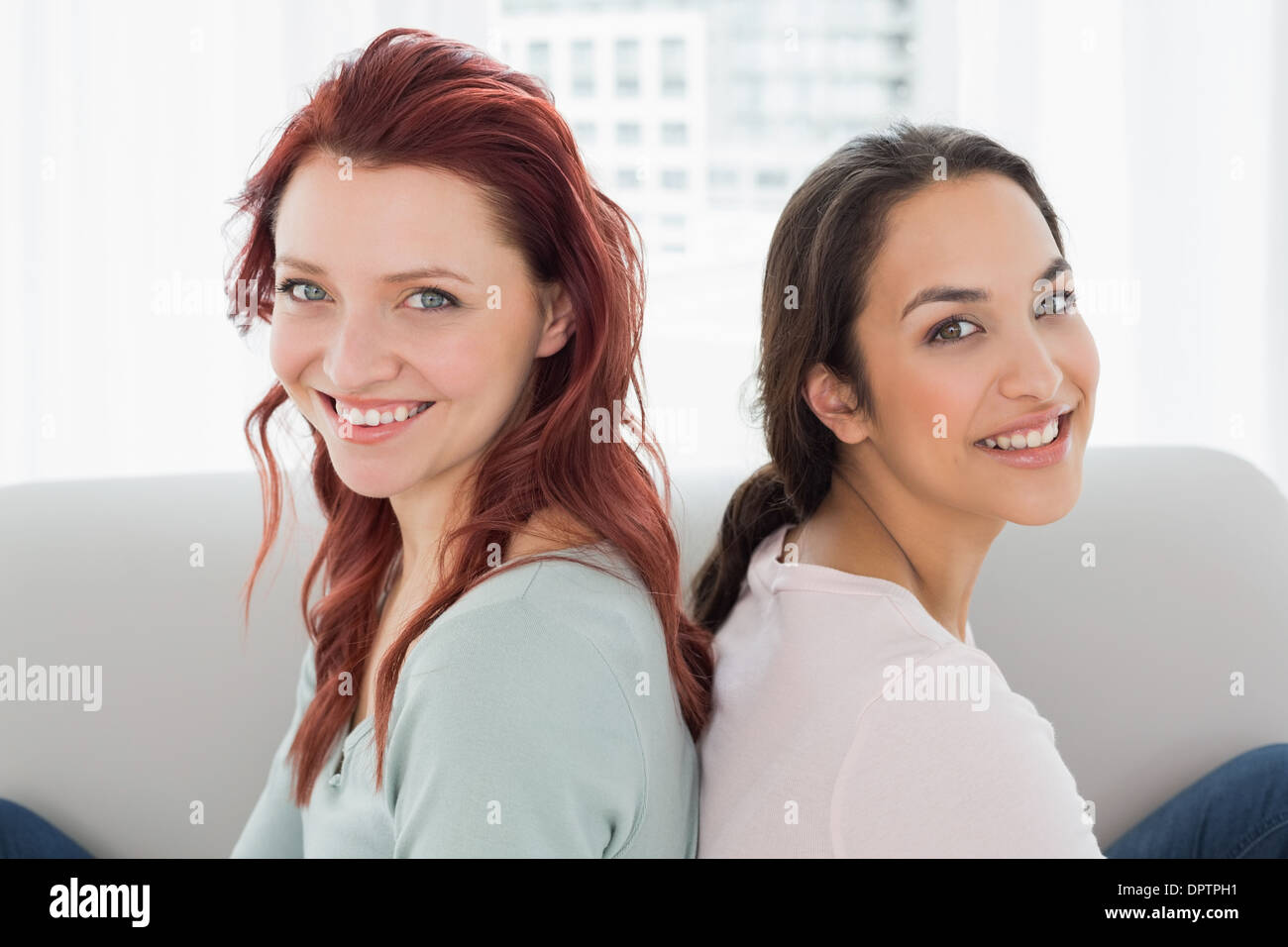 Beautiful female friends sitting hi-res stock photography and images ...