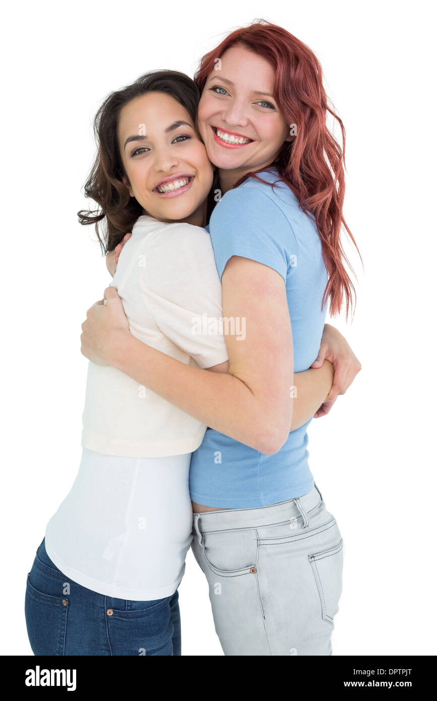 Side view portrait of a young female embracing her friend Stock Photo ...