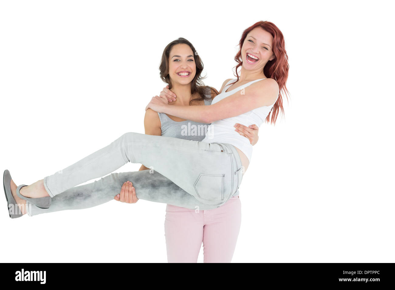 Portrait of a young female carrying her cheerful friend Stock Photo - Alamy