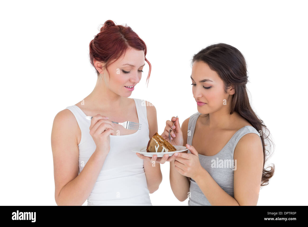 Beautiful young female friends pastry cake together Stock Photo - Alamy
