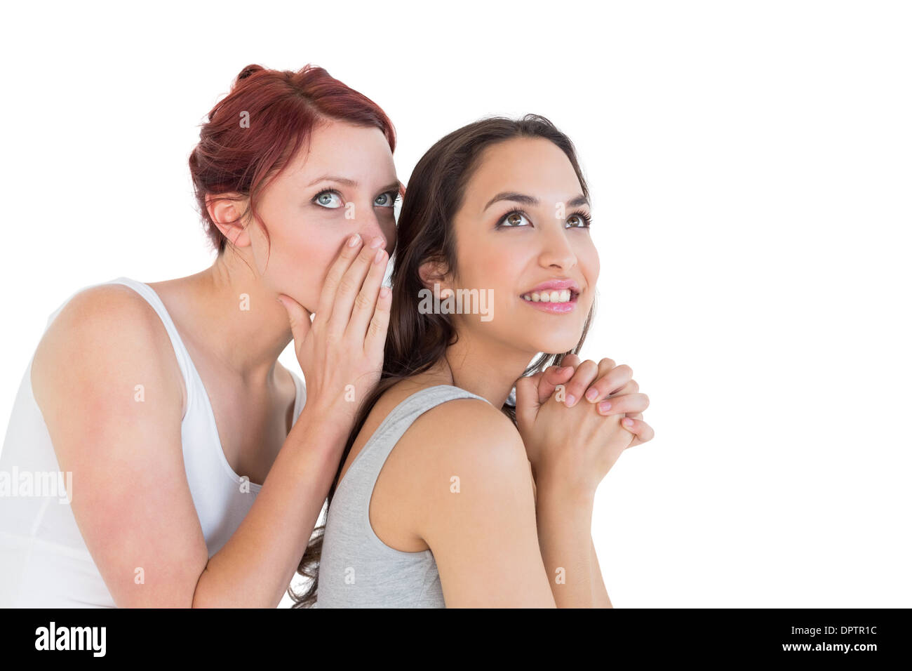 Close-up of two young female friends gossiping Stock Photo - Alamy
