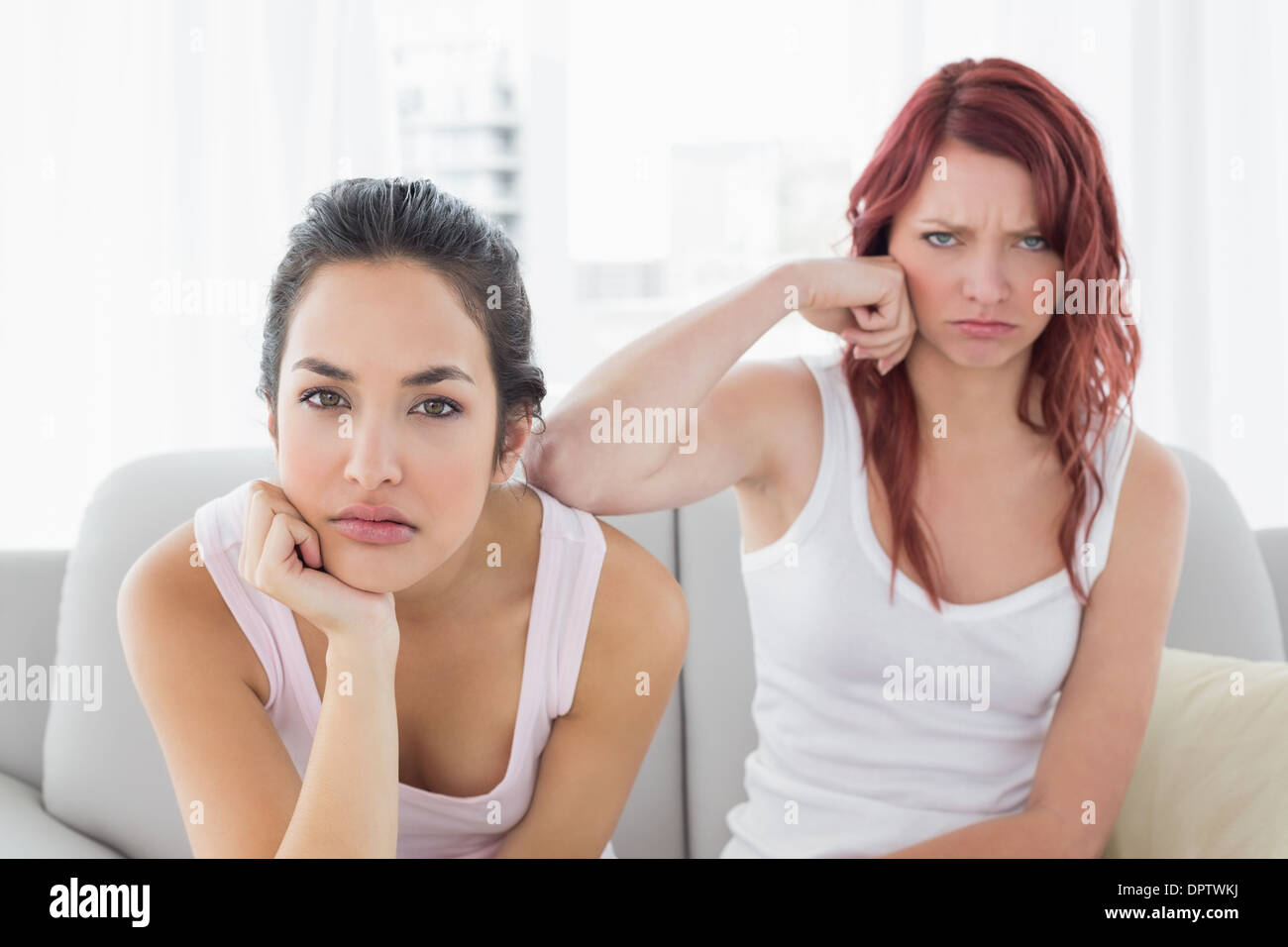 Unhappy female friends not talking after argument at home Stock Photo ...