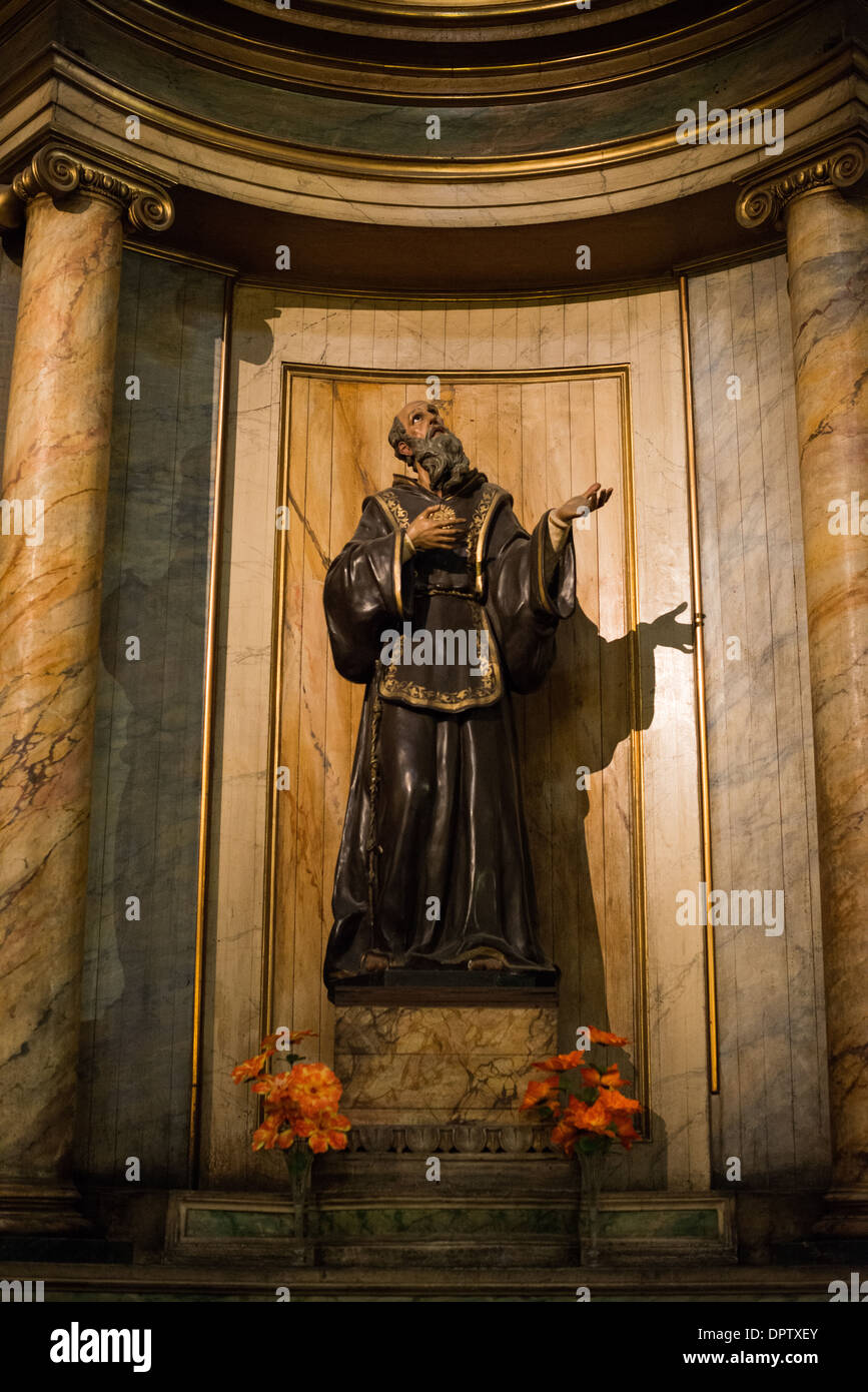 SANTIAGO, Chile — A statue of a priest with an upward gaze stands ...