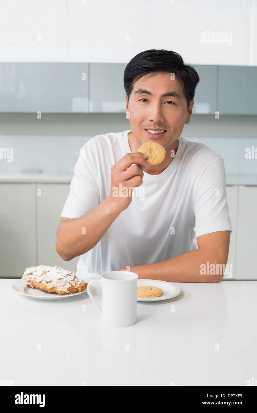 Man holding biscuits hi-res stock photography and images - Alamy