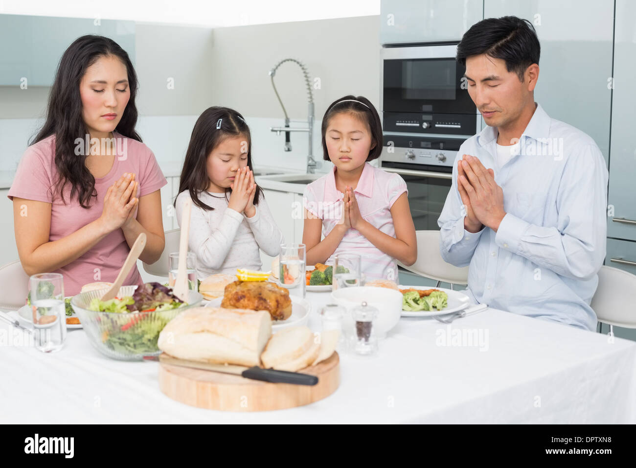 Children saying grace hi-res stock photography and images - Alamy