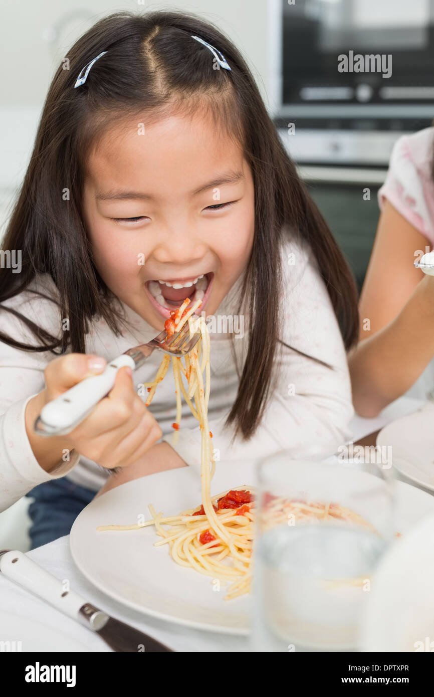 Kid eating spaghetti hi-res stock photography and images - Alamy