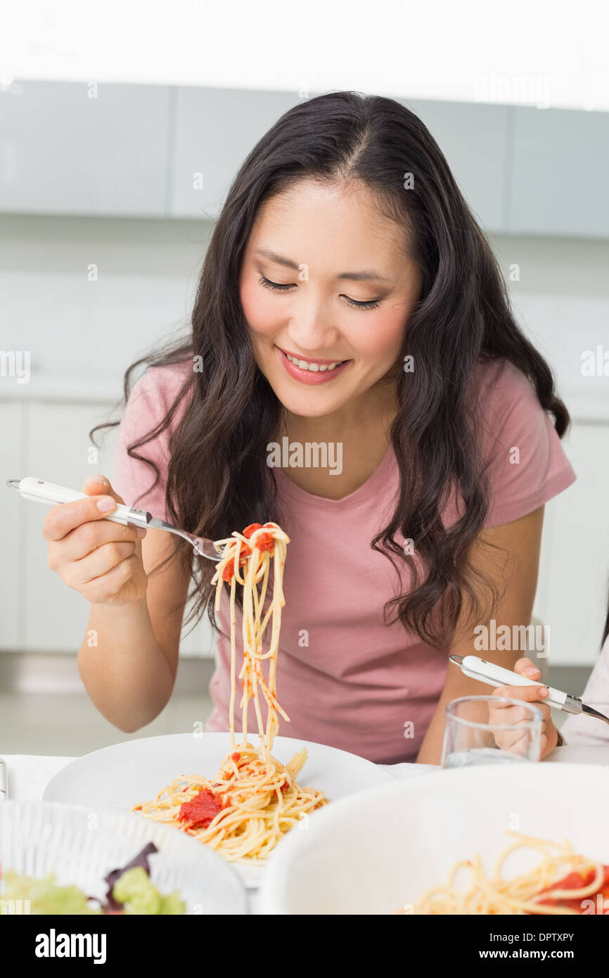 Woman eating spaghetti hi-res stock photography and images - Alamy