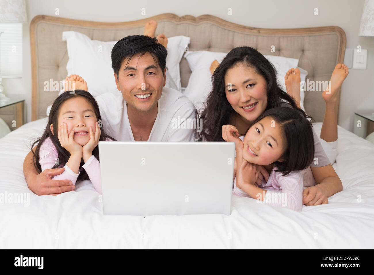 Happy family four using hi-res stock photography and images - Alamy