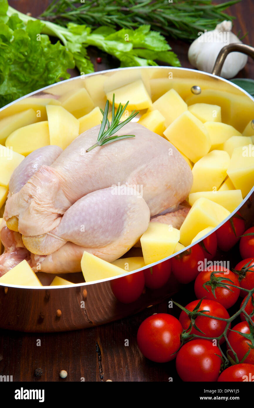 Raw - uncooked - chicken with vegetables Stock Photo - Alamy