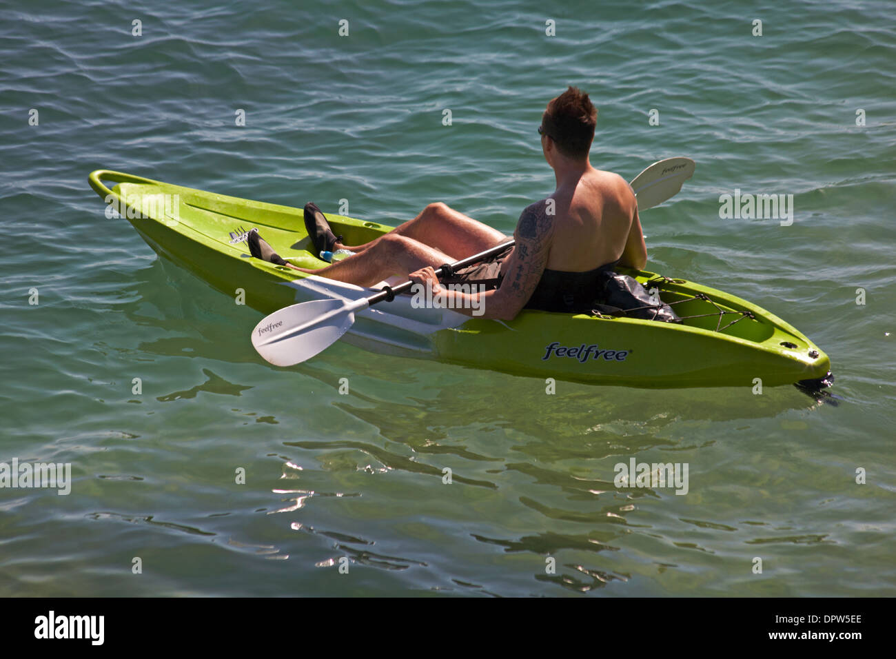 Man sitting in kayak in the sea at Bournemouth in August Stock Photo ...