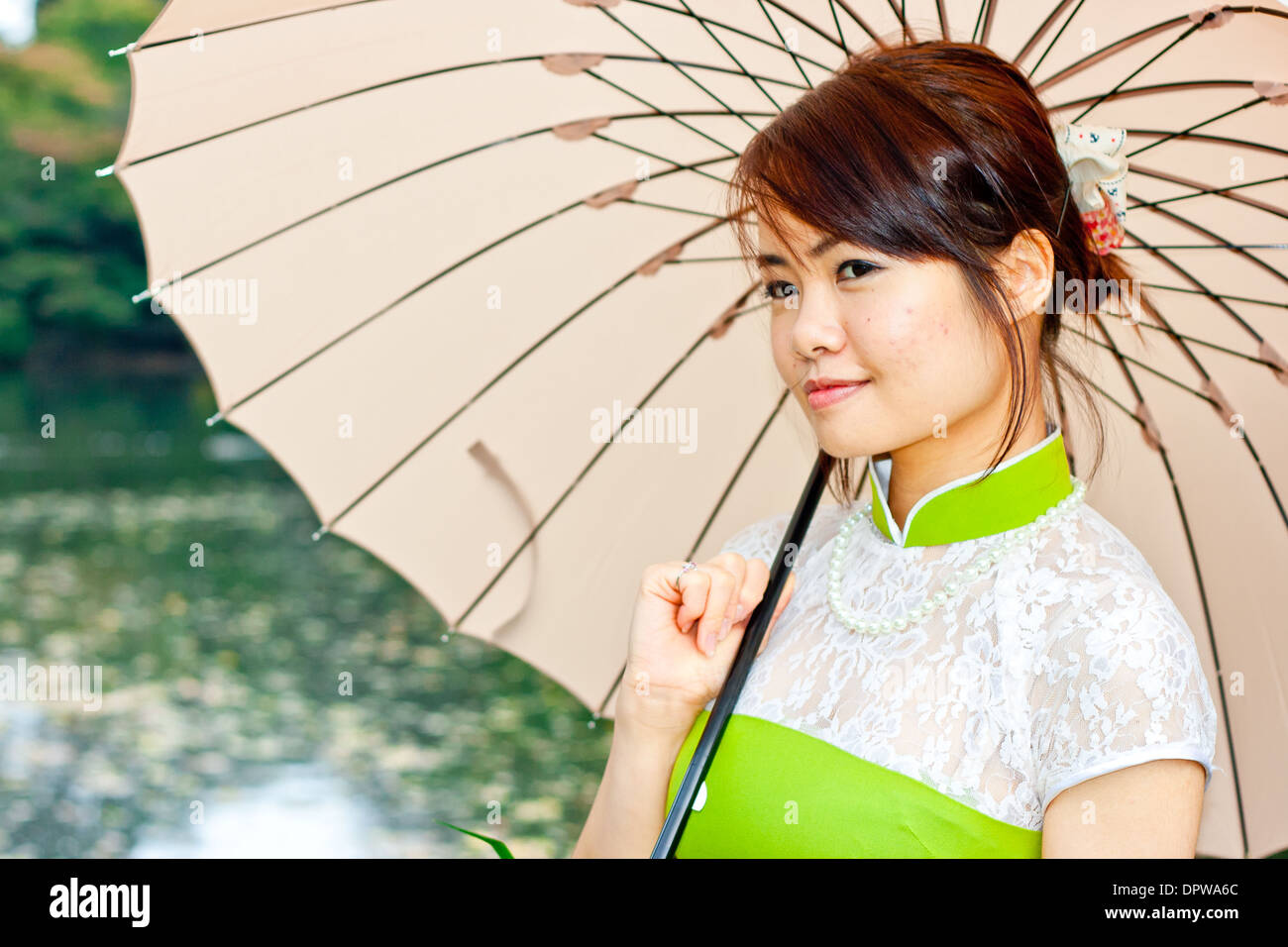 Lady with umbrella hi-res stock photography and images - Alamy