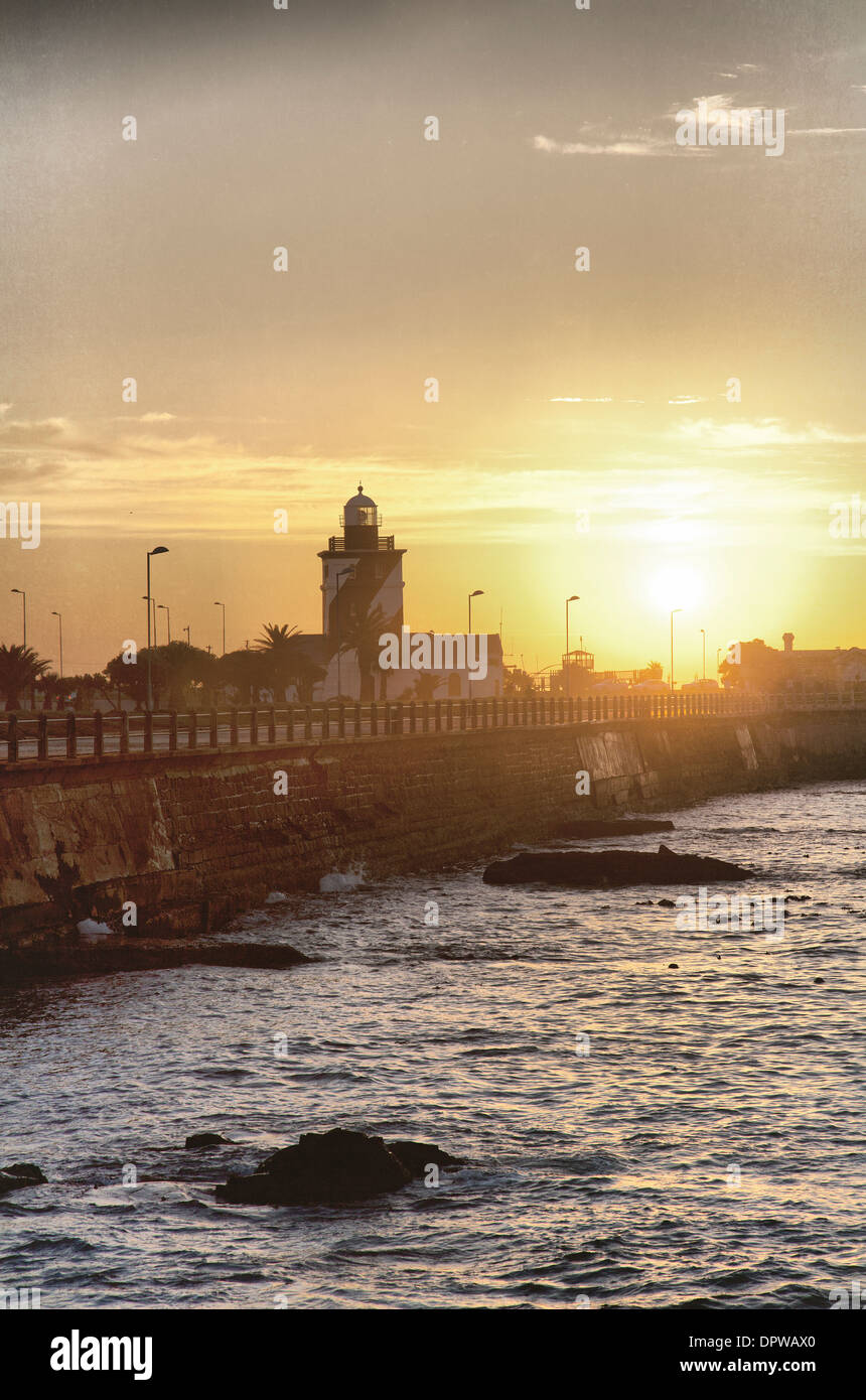 Lighthouse on Mouille Point Promenade Silhouetted by Sun in cape Town ...