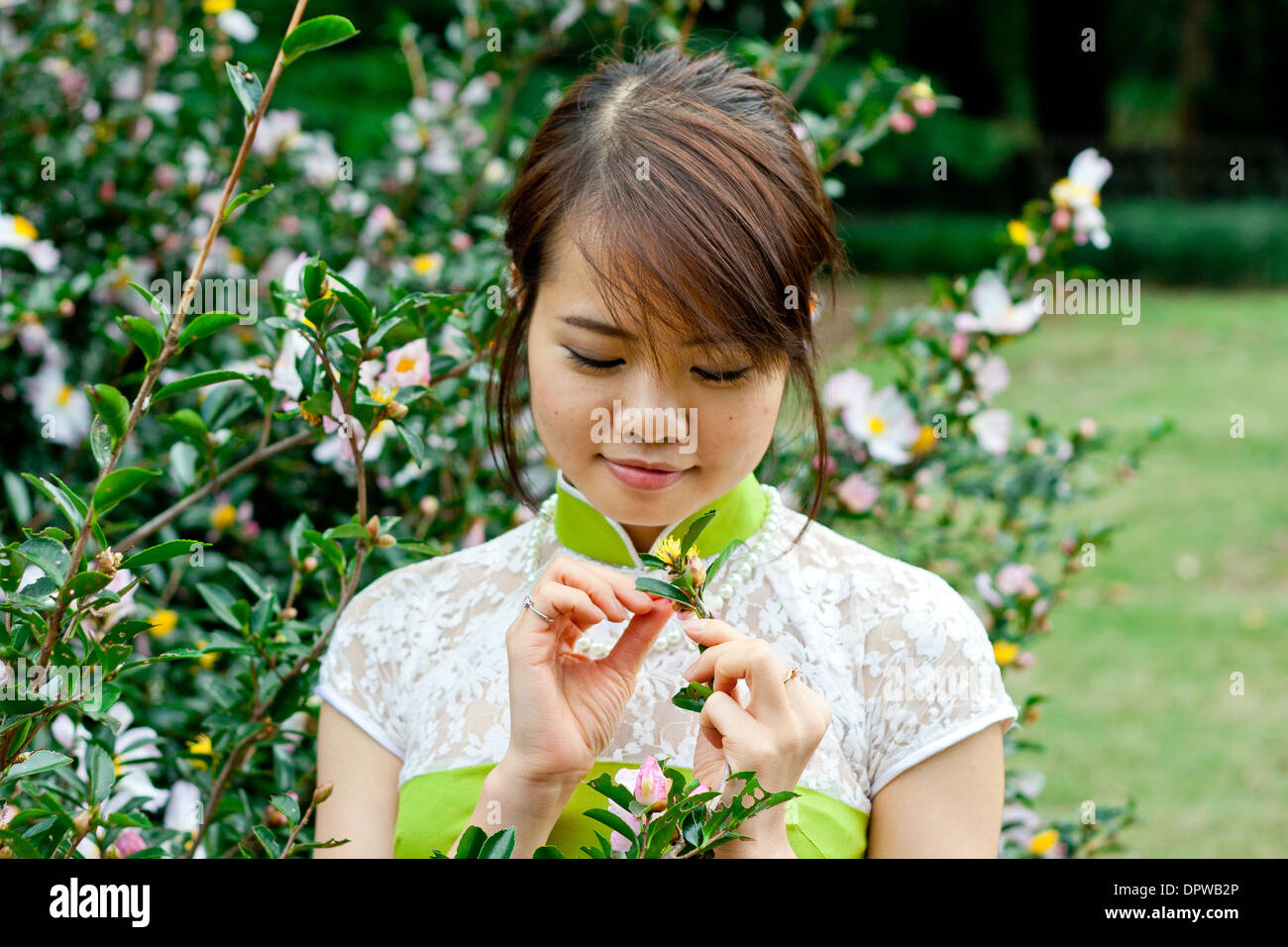 Girl picking up flowers hi-res stock photography and images - Alamy