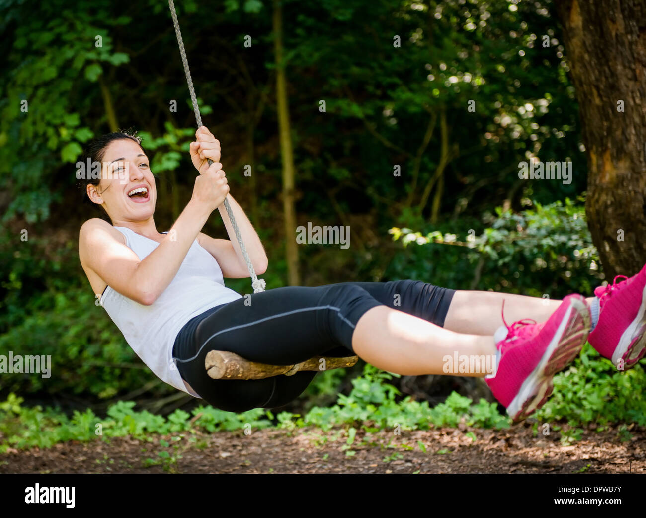 Swinging woman hi-res stock photography and images - Alamy
