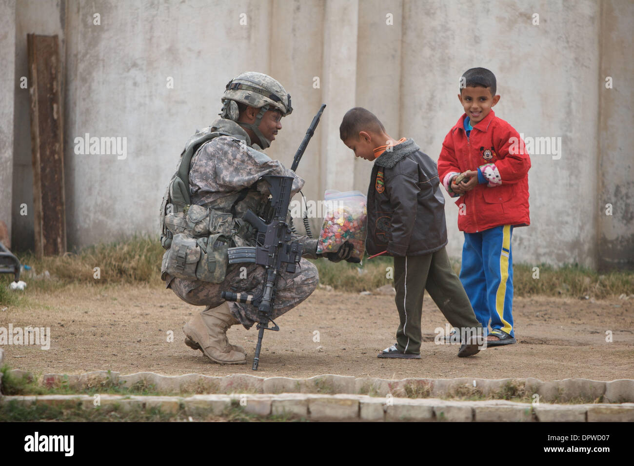 Feb 11, 2009 - Baghdad, Iraq - A U.S. Army soldier gives candy to ...