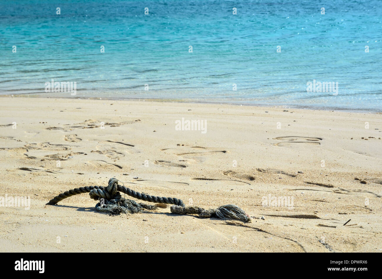 An old cord at a tropical sand beach Stock Photo - Alamy