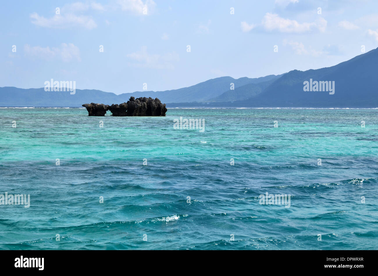 A coral island in a cobalt blue water at the island Ishigaki in Japan ...