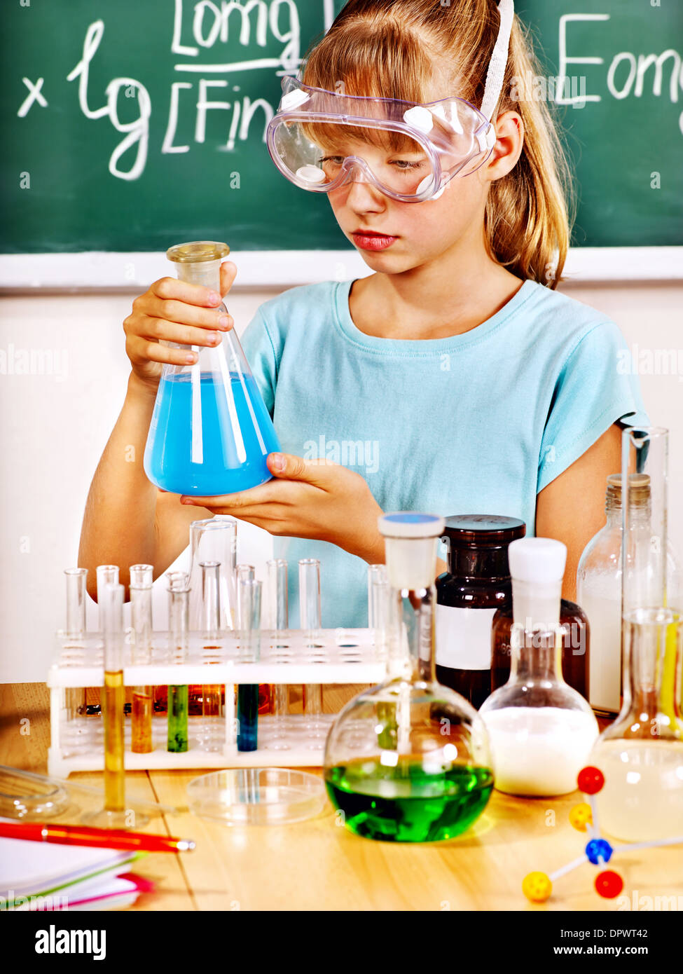 Child holding flask in chemistry class Stock Photo - Alamy