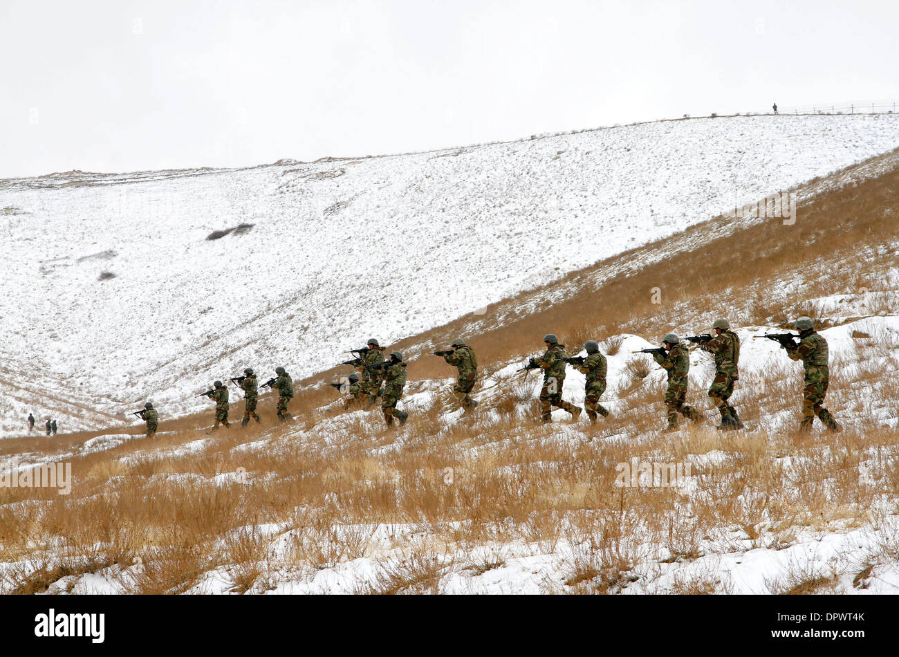 Afghan National Army commando recruits approach a linear danger area ...