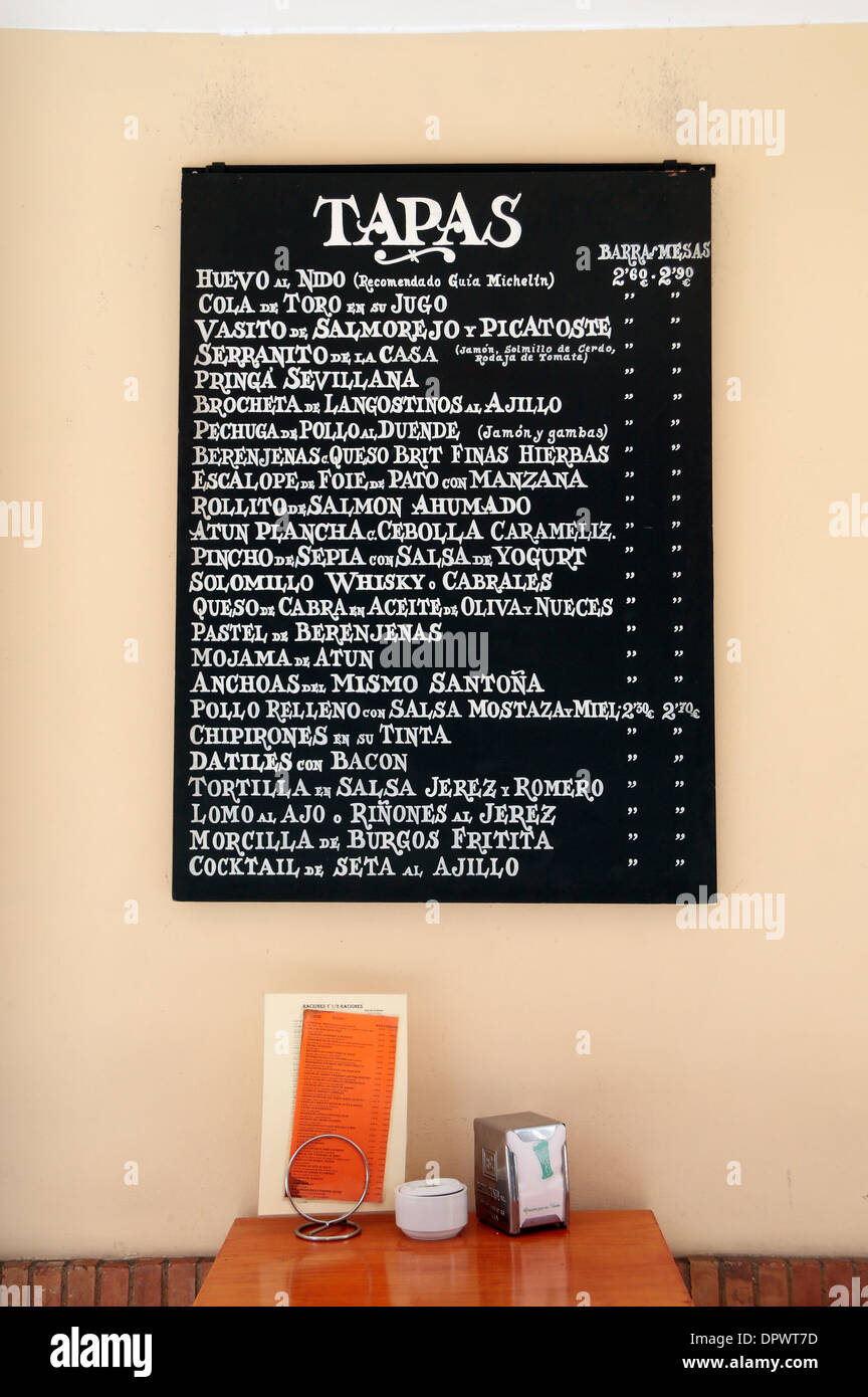 Tapas menu in a side street cafe in the Santa Cruz area of Seville ...