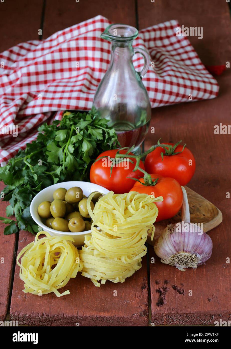 Italian still life - pasta, olive oil, tomatoes, garlic Stock Photo - Alamy