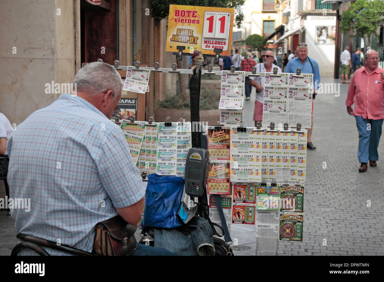 An ONCE lottery ticket seller, a common sight in Seville (Sevilla ...
