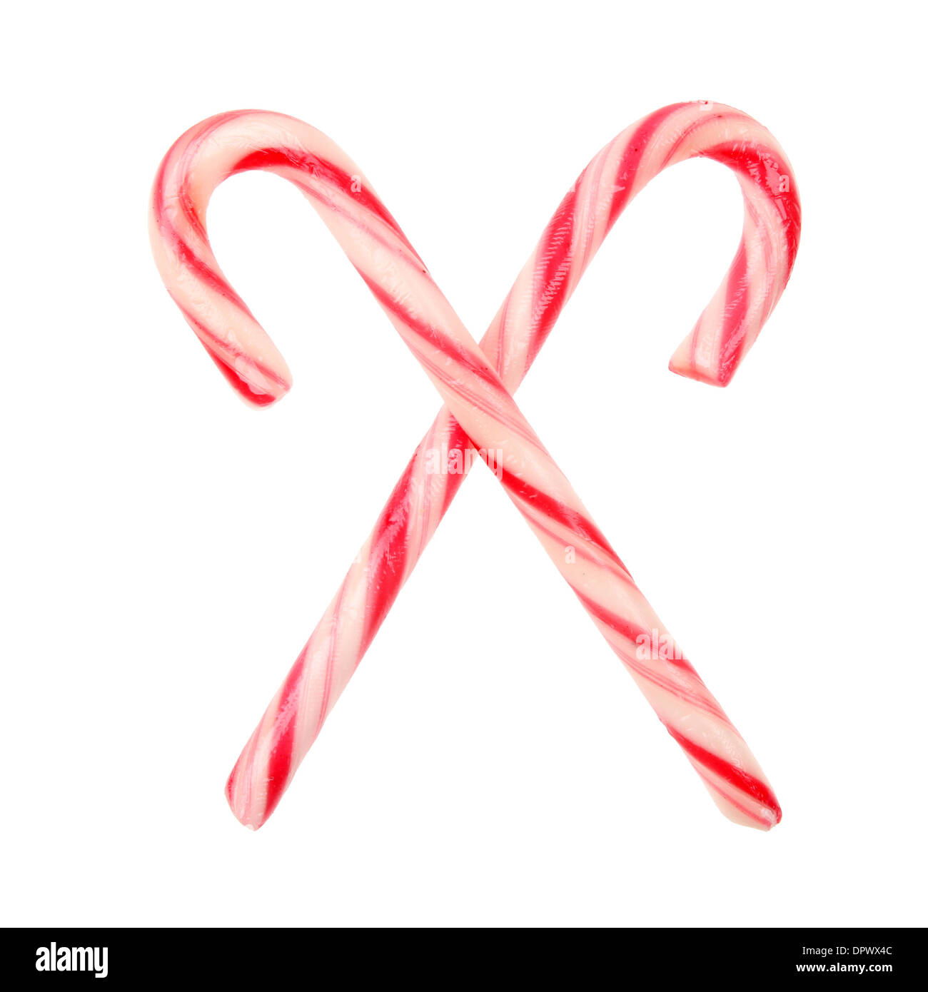 Two sugar candy canes isolated against white Stock Photo - Alamy