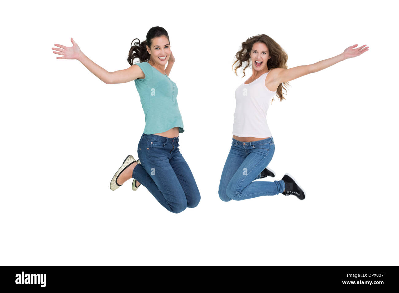 Two jumping woman hi-res stock photography and images - Alamy