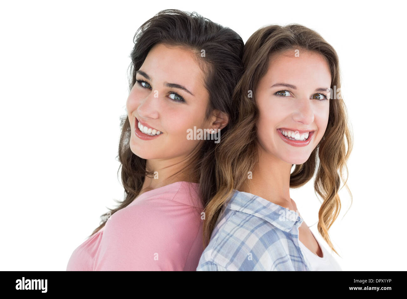 Side view portrait of two happy young female friends Stock Photo - Alamy
