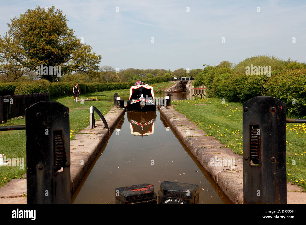 A narrowboat entering Lock 4 of the Bosley flight of locks on the ...