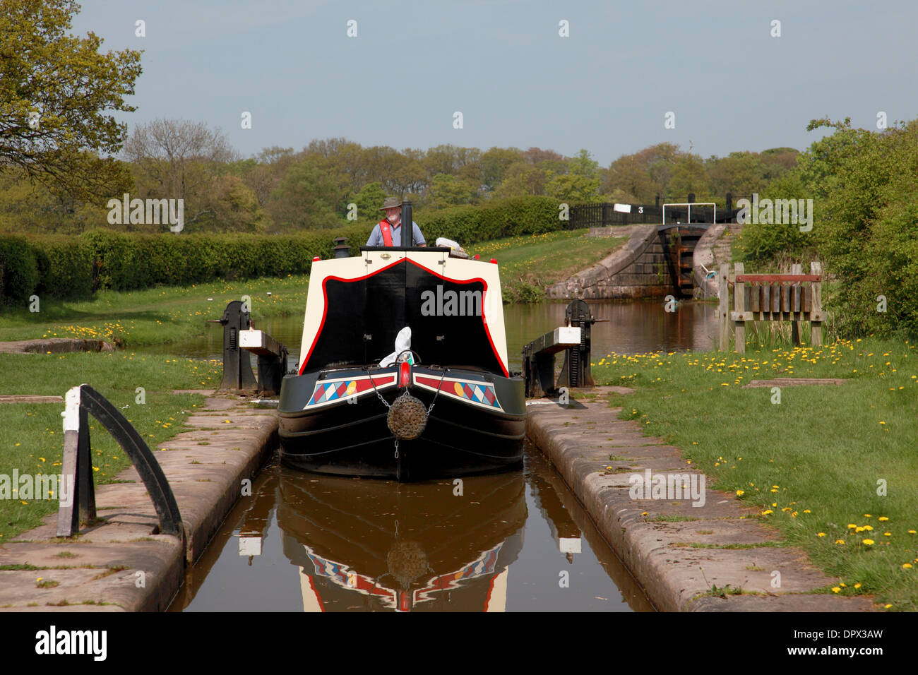 A narrowboat entering Lock 4 of the Bosley flight of locks on the ...
