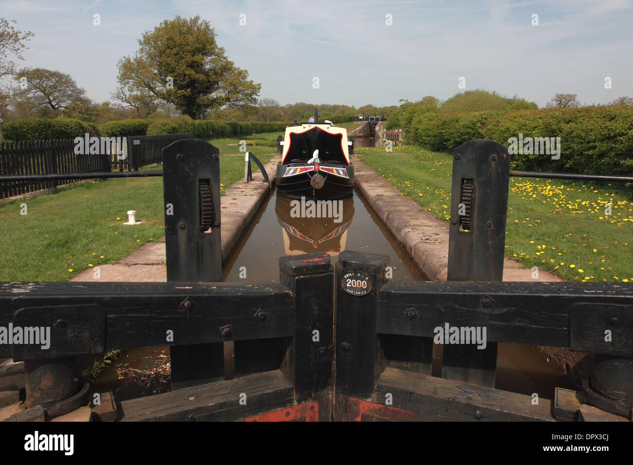A narrowboat in Lock 4 of the Bosley flight of locks on the ...