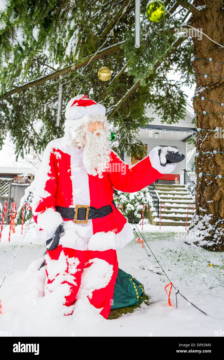 Santa Claus Christmas decoration with snow Stock Photo - Alamy