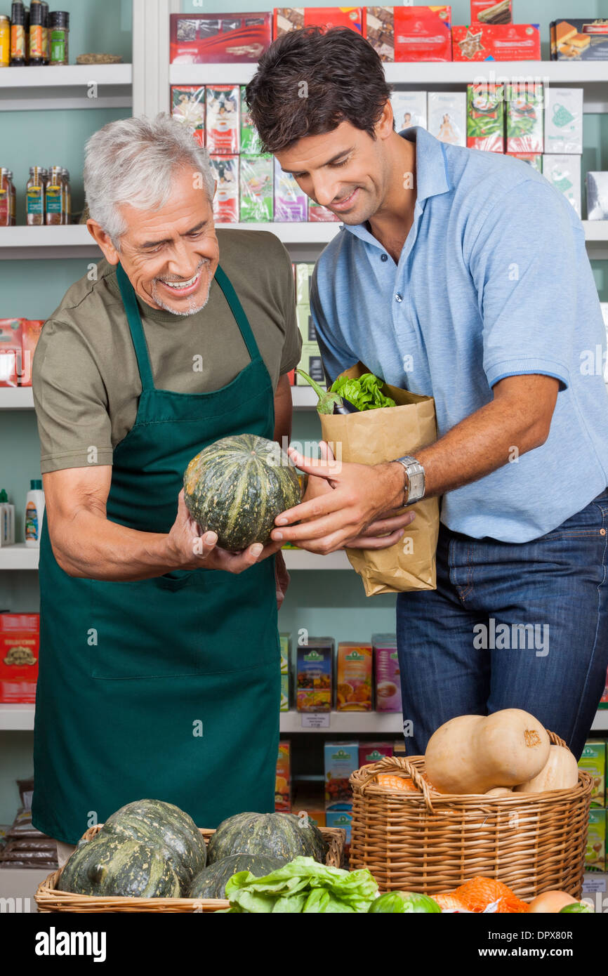 Salesman Assisting Male Customer Stock Photo - Alamy