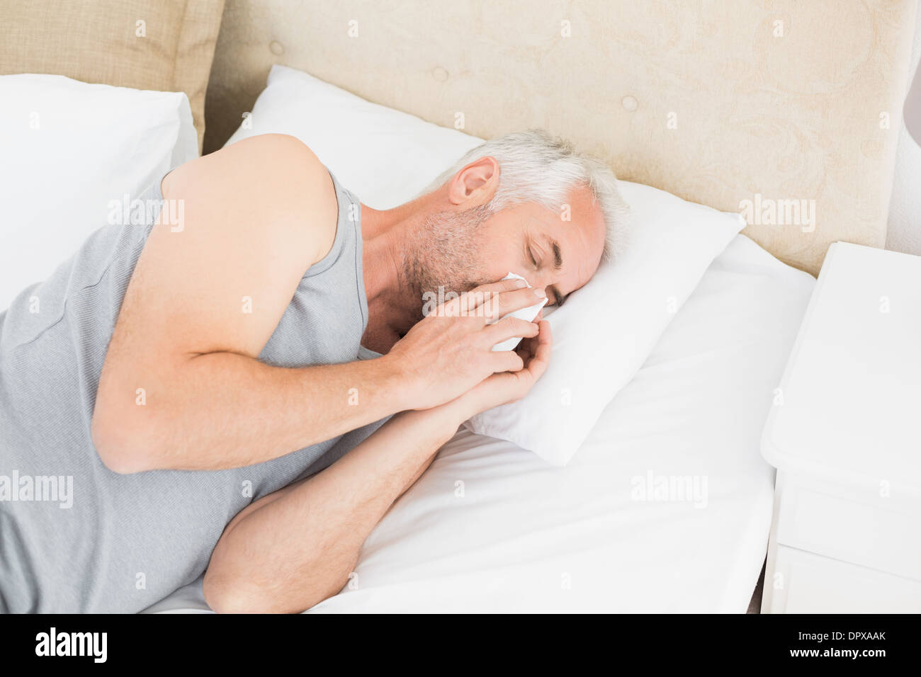 Man cold in bed hi-res stock photography and images - Alamy