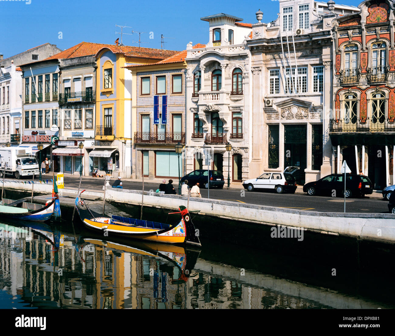 View of Aveiro Canal showing traditional moliceiro boats and riverside ...