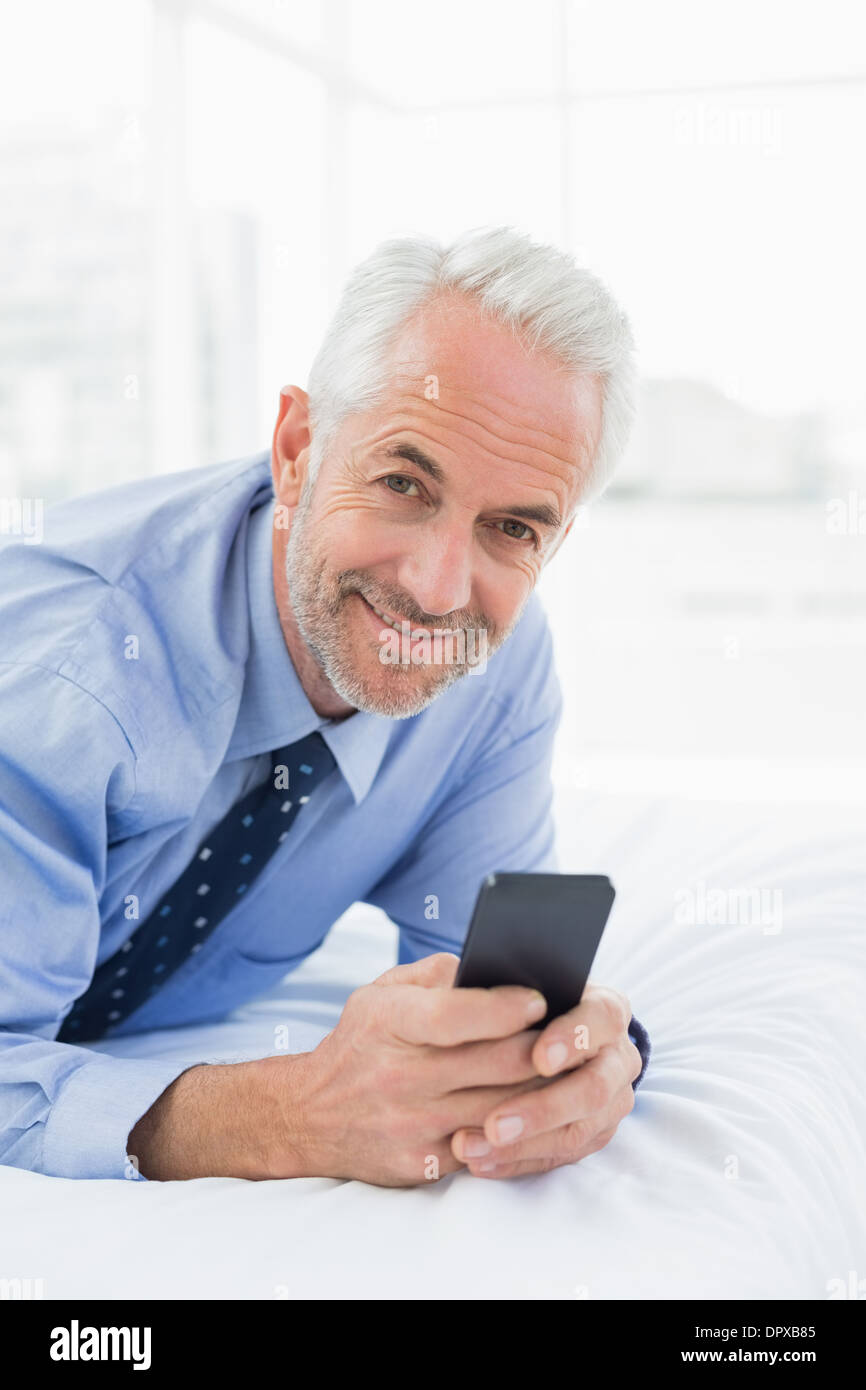 Relaxed well dressed man text messaging in bed Stock Photo - Alamy Relaxed well dressed man text messaging in bed Stock Photo - Alamy