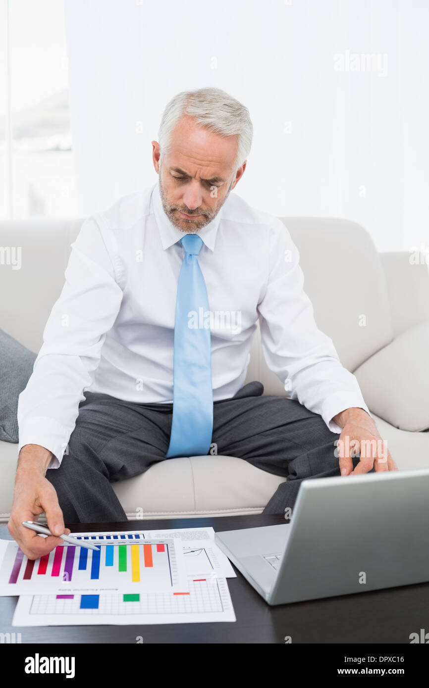 Businessman working on graphs hi-res stock photography and images - Alamy