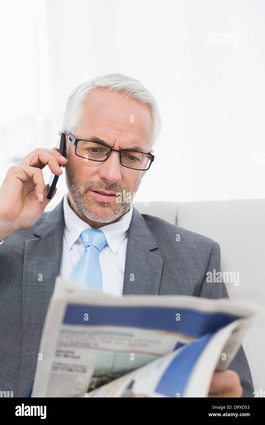 Reading newspaper spectacles grey hi-res stock photography and images ...