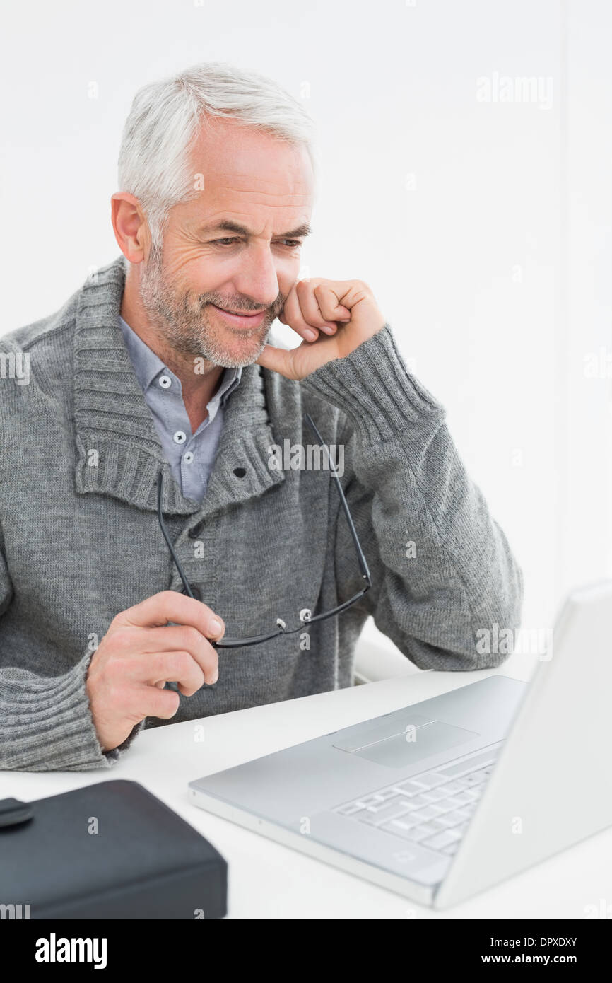 Man smiling desk hi-res stock photography and images - Alamy