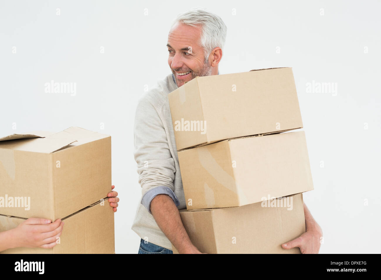 Man carrying brown boxes hi-res stock photography and images - Alamy