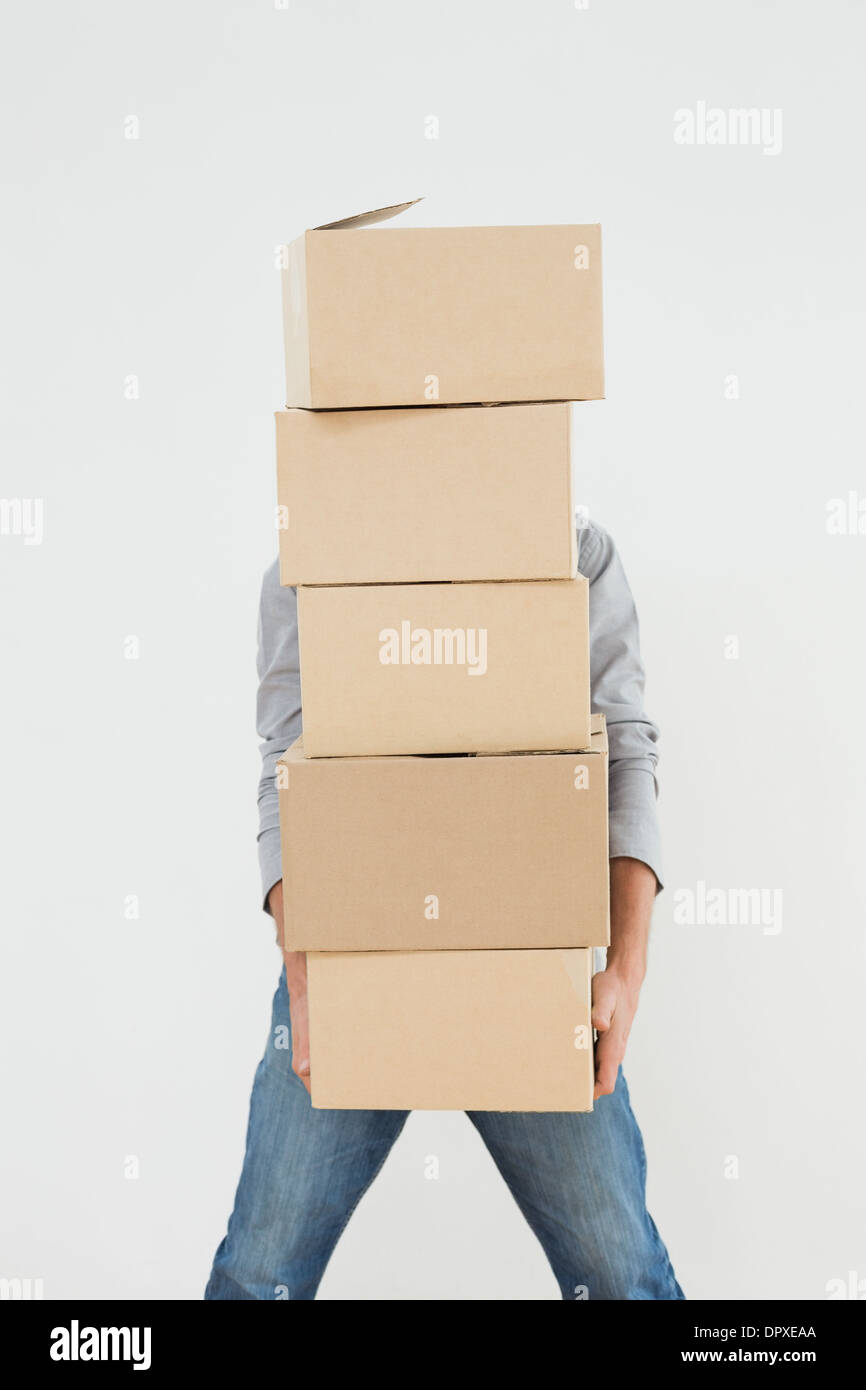 Obscured man carrying boxes hi-res stock photography and images - Alamy