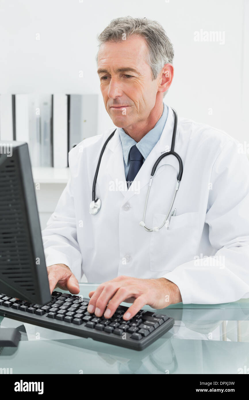 Doctor using computer at medical office Stock Photo - Alamy