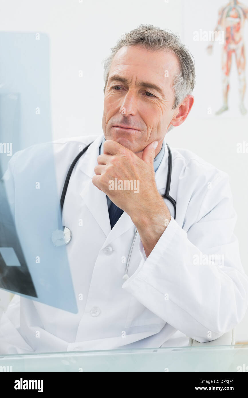 Mature doctor looking scan hi-res stock photography and images - Alamy